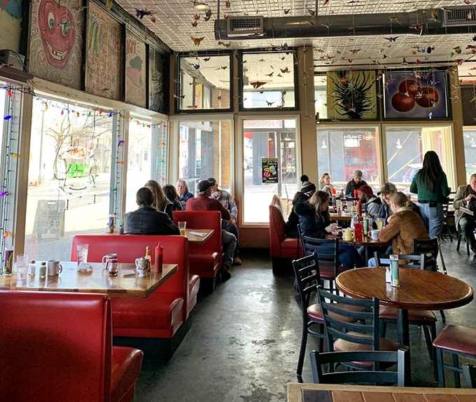 The bright, airy dining room buzzes with conversation and caffeine. Red booths invite you to settle in and stay awhile.