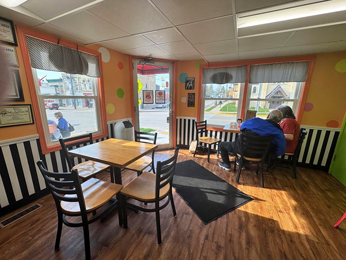 The ice cream parlor's sunny interior invites you to linger, chat, and contemplate the serious business of dessert selection.