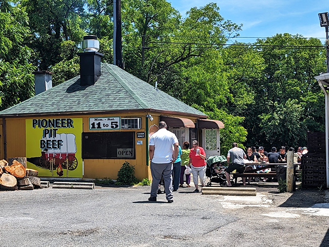 Happy diners discovering why word-of-mouth recommendations never lie about authentic pit beef perfection.