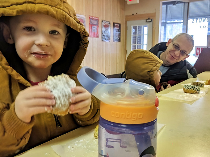 Childhood donut memories being made in real-time&mdash;powdered sugar mustaches are the badges of honor in this delicious rite of passage.