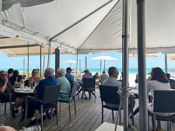 Beachfront dining where the dress code is "whatever makes you happy." The ocean provides both the view and the menu.