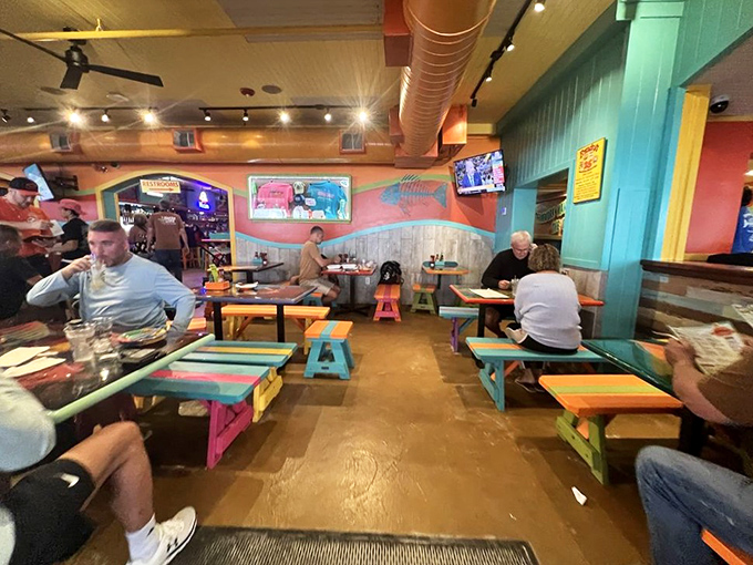 Colorful picnic tables and beachy vibes create the perfect backdrop for that "I can't believe we live here" moment with friends.