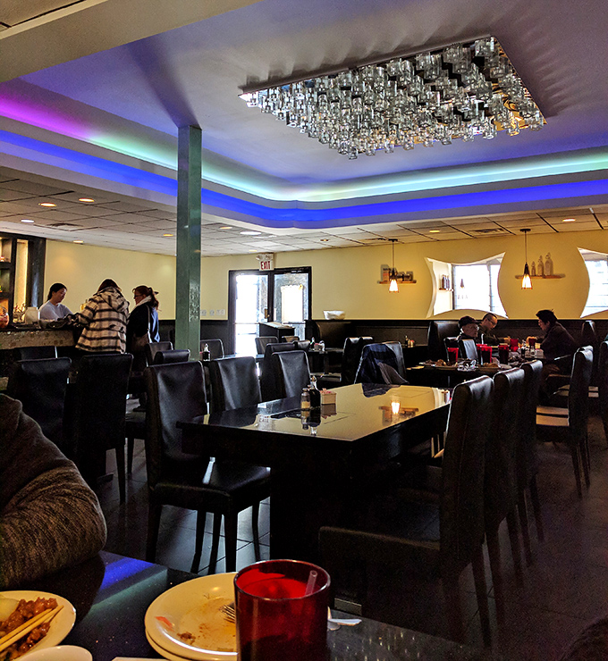The dining room's crystal chandelier adds unexpected elegance, like finding out your favorite sweatpants-wearing friend secretly knows three languages and plays classical piano.