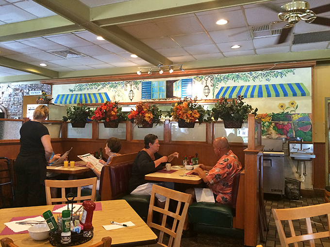 The mural and booth seating create that perfect diner atmosphere where conversations flow as freely as the coffee.