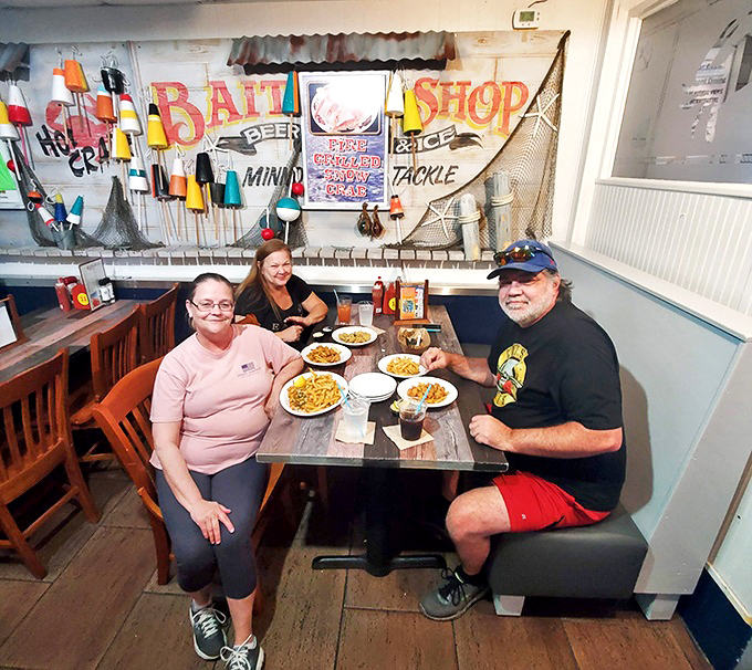 The bait shop dining area offers a glimpse into authentic Florida coastal life, where fishing stories get better with each telling and every meal.