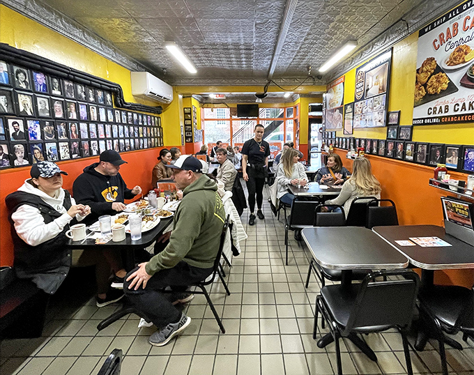 The true Annapolis experience: Naval Academy midshipmen, locals, and visitors breaking bread in a symphony of satisfied munching.