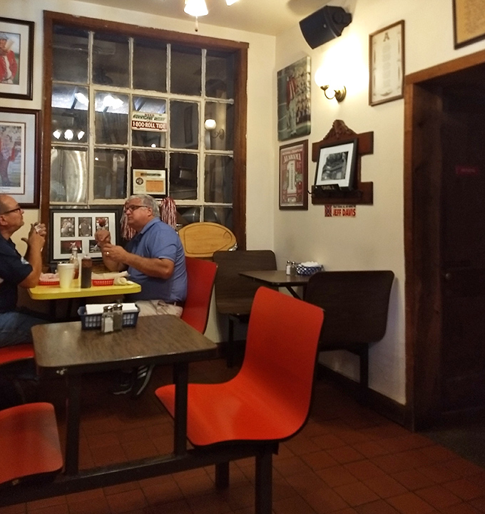 The dining room feels like someone's living room where football and barbecue form the foundation of a beautiful friendship.