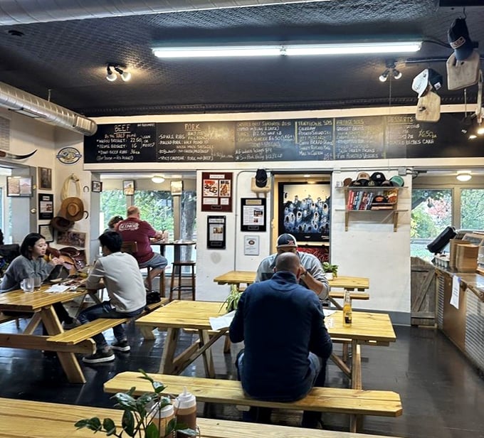 The universal language of barbecue brings strangers together at communal tables. Notice the focused silence&mdash;that's the sound of serious eating.