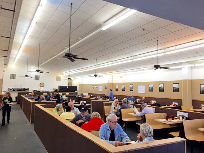 The dining room hums with the symphony of forks against plates and coffee cups meeting saucers. Every booth tells a story.