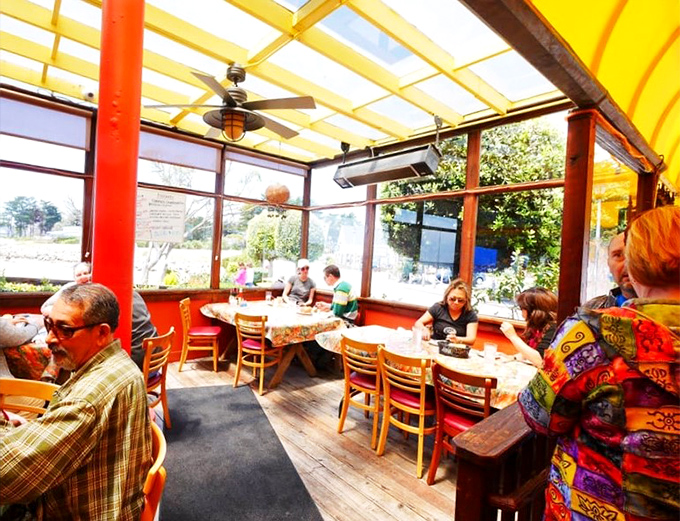 The sunlit dining room feels like being inside a cheerful fisherman's daydream, where conversations flow as easily as the seafood orders.