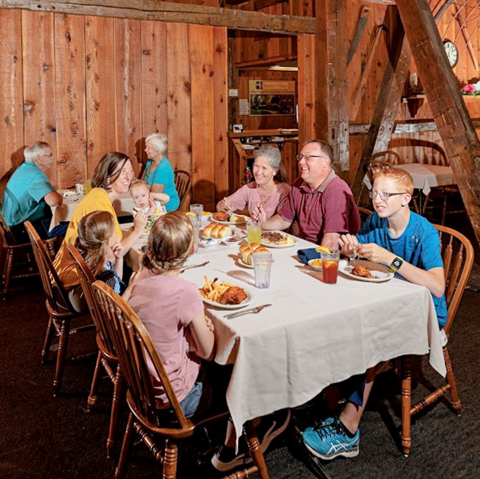Three generations sharing a meal in the warm wooden interior&mdash;creating memories that will last longer than the food on their plates.