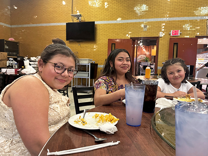 The true measure of any restaurant: families making memories around a table, their plates telling stories of personal buffet strategies.