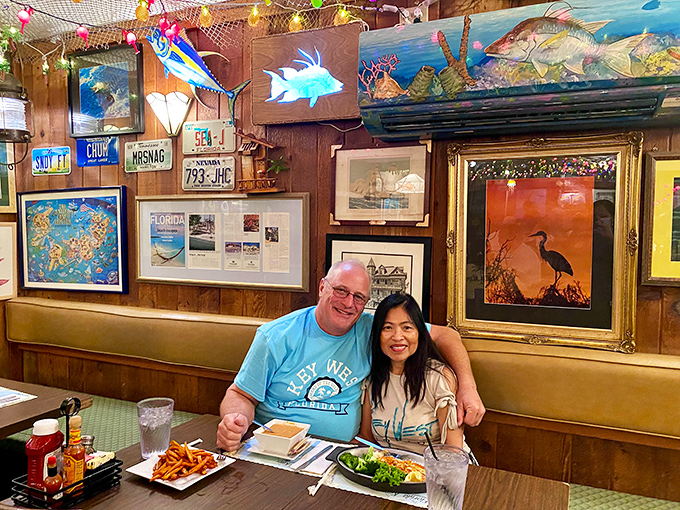 The wooden walls adorned with maritime art create the perfect backdrop for making memories over plates of fresh-caught seafood.
