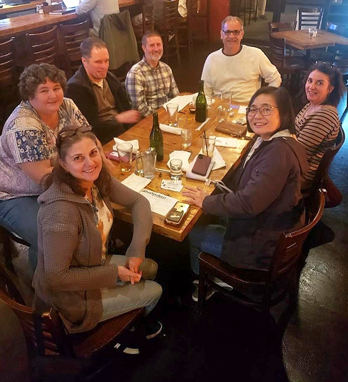 The true measure of a great tavern: happy people gathered around a table, creating memories between bites and sips.