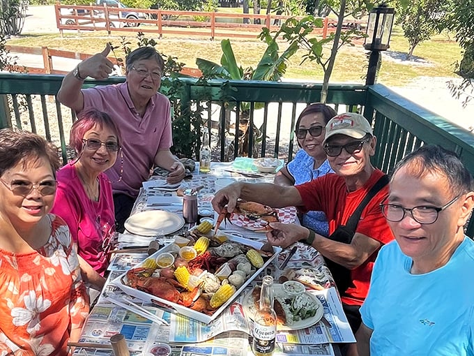 The universal language of seafood bringing people together. Nothing builds friendship faster than collectively demolishing trays of blue crab on newspaper-covered tables.