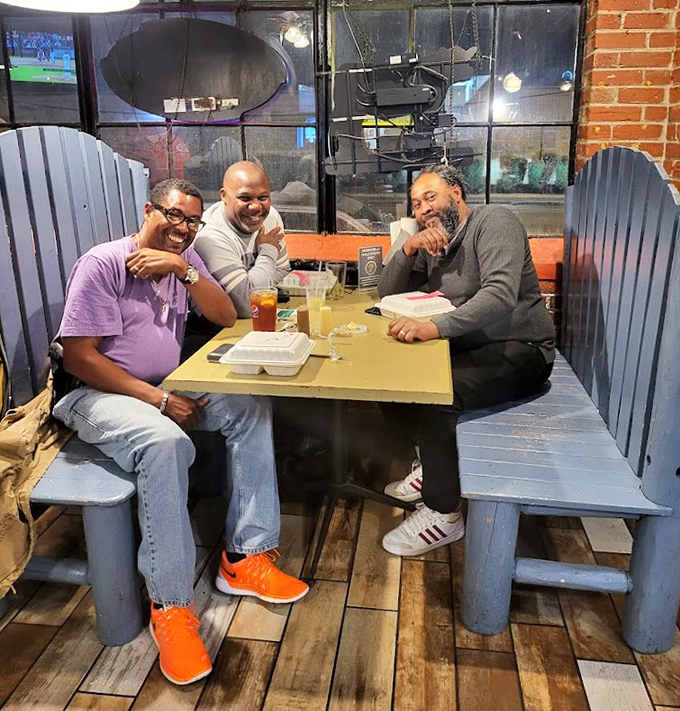 The universal language of barbecue bringing friends together. Those smiles say everything words can't about what's on those plates.