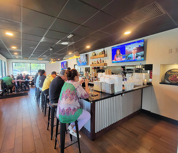 The packed dining room tells the real story - locals know where to find authentic barbecue excellence.