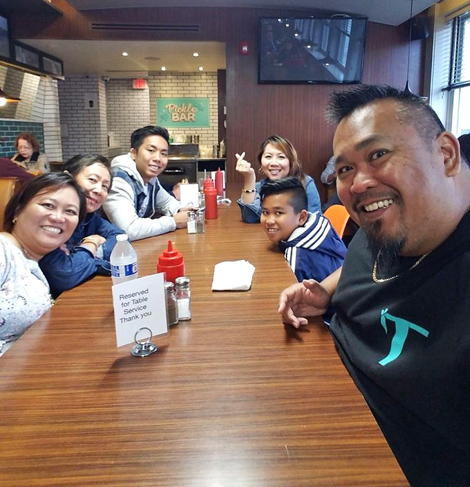 Happy faces around the table &ndash; the universal language of "we ordered way too much and regret nothing."