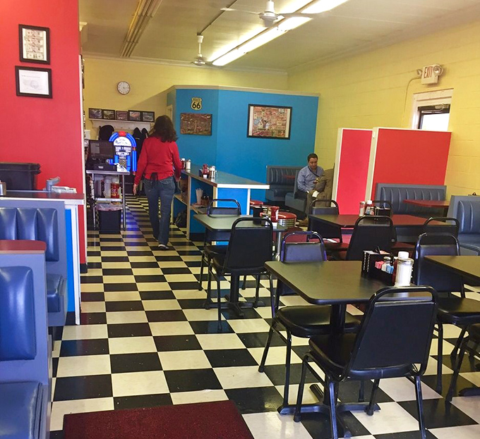 The dining room where strangers become temporary breakfast companions, united by the universal language of "pass the syrup, please."