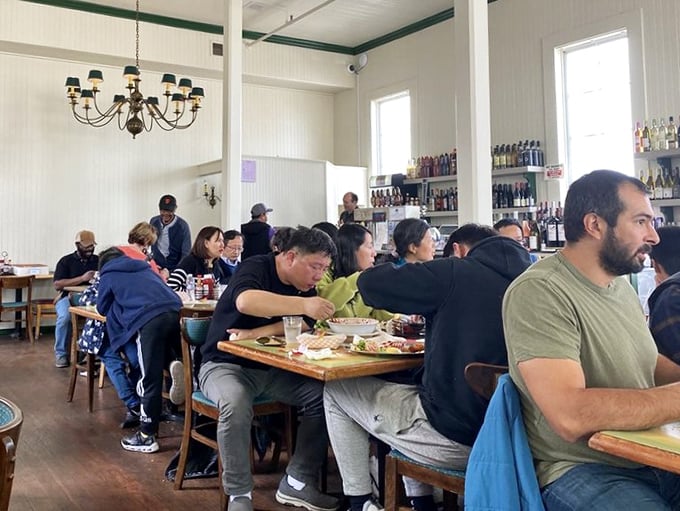 The dining room hums with the universal language of "mmm" as strangers become comrades united by the pursuit of perfect seafood.