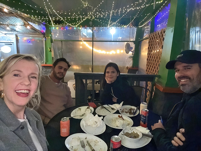 Happy faces tell the real story - this is where strangers become friends over exceptional food.