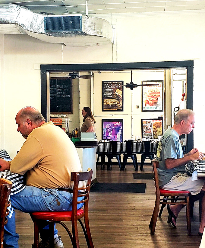 The regulars know exactly where to sit and what to order. These gentlemen have probably solved all of Tucker's problems over countless meat-and-threes.