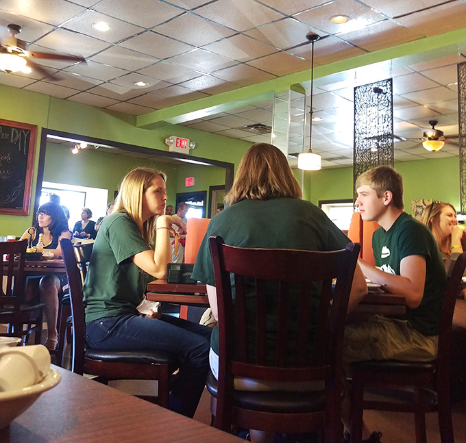 The breakfast buzz in full swing&mdash;where strangers become friends united by the universal language of "pass the syrup, please."