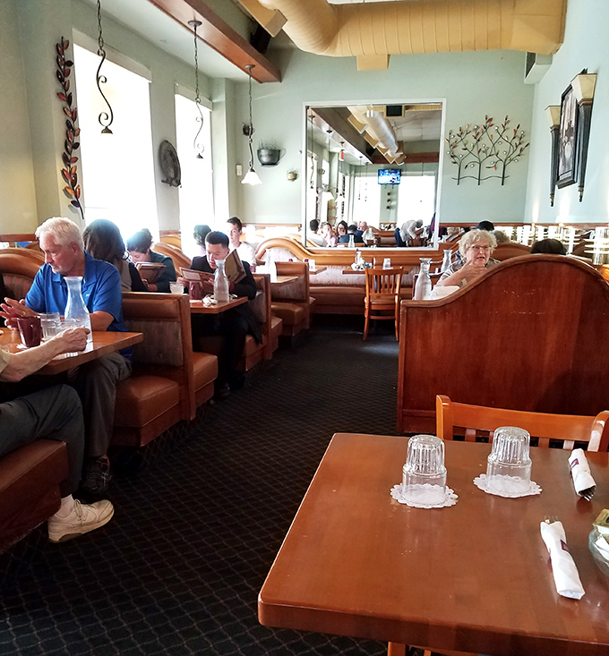 The dining room hums with the comfortable energy of regulars who've claimed their favorite booths through years of loyal patronage.