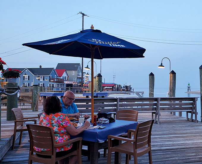 Twilight dining on the deck&mdash;where conversations flow as easily as the tide beneath your feet.