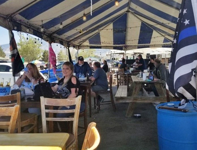 The outdoor tent area: where strangers become friends over shared appreciation of good food and desert breezes.