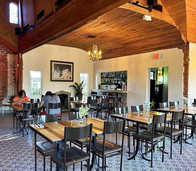 The dining room balances rustic charm with modern elegance, where every table feels like the best seat in the house.