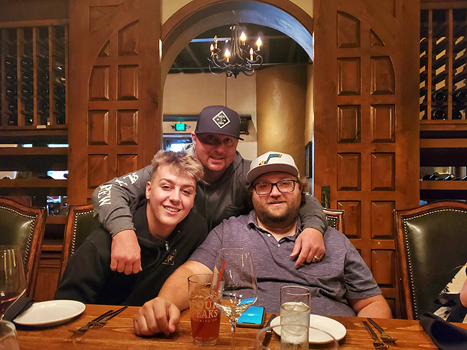 The wine cellar backdrop transforms ordinary dinner conversation into the kind of evening that makes you forget to check your phone.