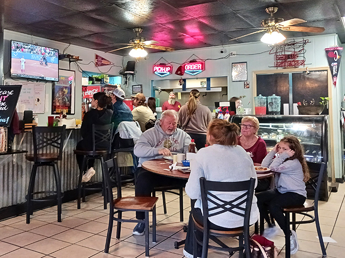 The true measure of a great local spot: multi-generational families sharing meals and stories while sports play quietly on TVs nobody's watching.