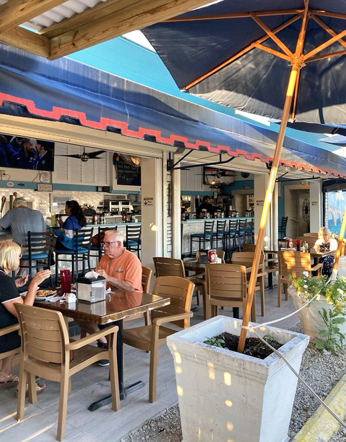 The outdoor seating area offers the perfect blend of shade and sea breeze&mdash;where breakfast conversations flow as easily as the coffee.