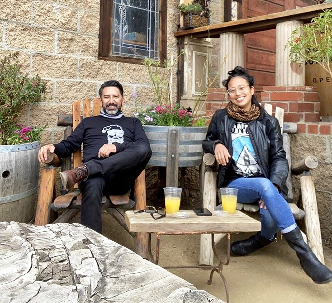 The outdoor seating area invites lingering conversations and spontaneous friendships &ndash; rustic chairs practically demanding you slow down and stay awhile.