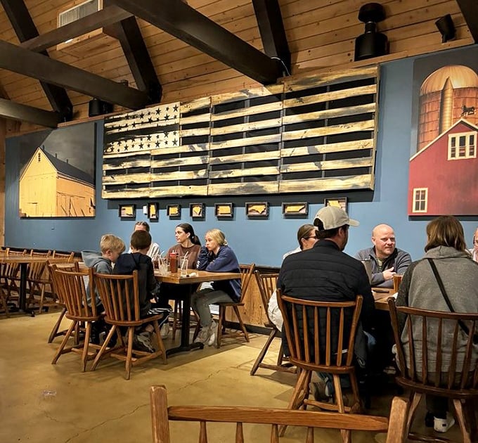 The rustic Americana d&eacute;cor featuring barn murals and a wooden flag creates the perfect setting for families to gather around barbecue bounty.