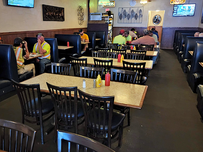 The dining room hums with the beautiful symphony of people enjoying honest food. Notice the condiments standing at attention, ready for their supporting roles in your meal.