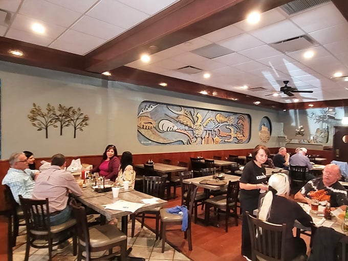 Happy diners enjoying authentic flavors in a setting that feels like your favorite neighborhood taverna back home.