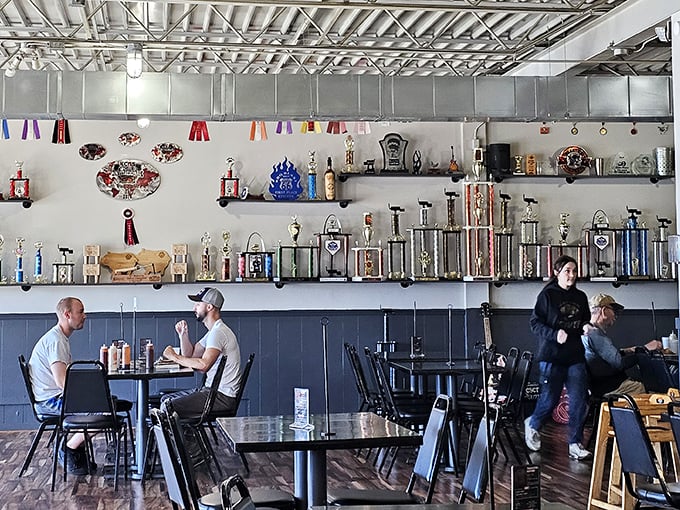 The wall of trophies tells you everything you need to know&mdash;these folks aren't just making barbecue, they're creating award-winning masterpieces that keep the competition sweating.