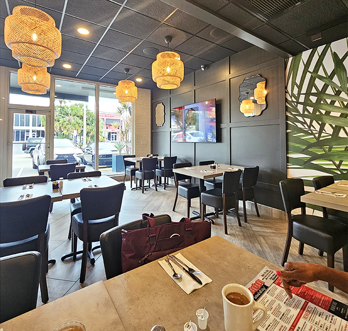 Modern touches meet classic diner comfort with those woven pendant lights casting a warm glow over your breakfast deliberations.
