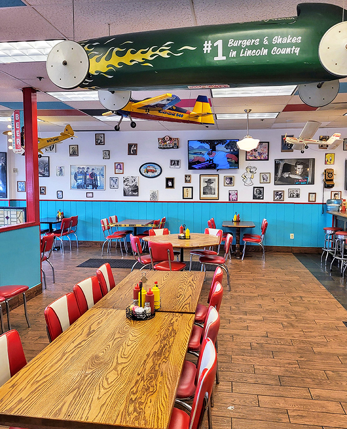 That torpedo-shaped sign proclaiming "#1 Burgers & Shakes in Lincoln County" isn't just decoration—it's a mission statement hanging from the ceiling.