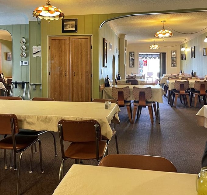 The dining room stretches back like a portal to simpler times. Those arched doorways have witnessed countless food comas and "I shouldn't, but I will" moments.