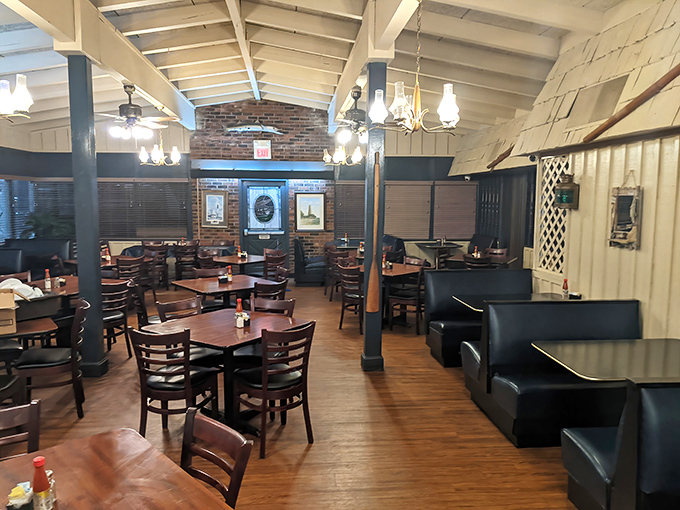 Simple wooden tables, ladder-back chairs, and exposed beams create the perfect backdrop for seafood feasts and lingering conversations.