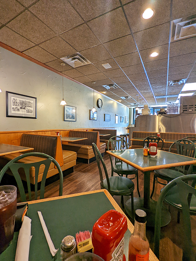 Wood paneling, green chairs, and tables that have supported countless elbows—this dining room has witnessed more Cincinnati history than the local news archives.