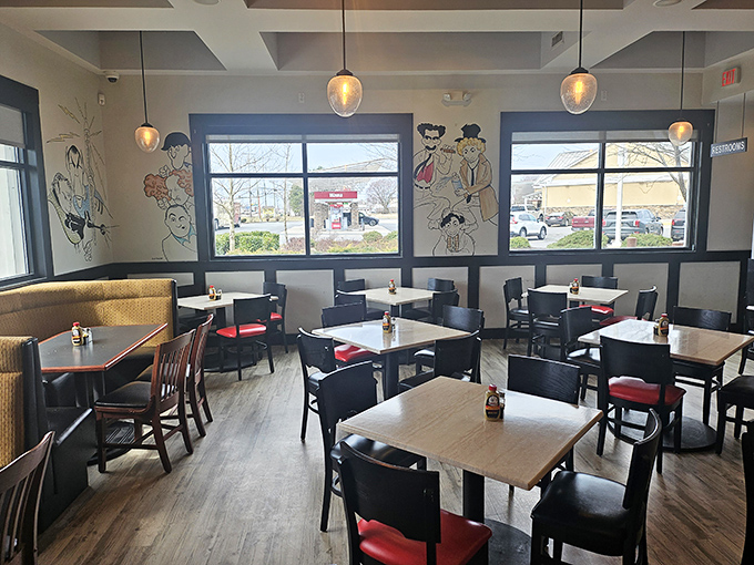 Modern meets nostalgic in the dining room, where pendant lights cast a warm glow over conversations and sandwich contemplations.