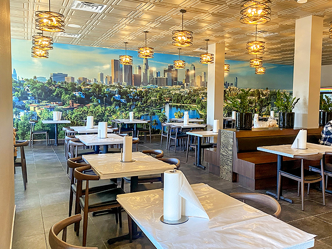 The dining area features a stunning LA skyline mural—because nothing complements seafood like a reminder that you're feasting in the City of Angels.
