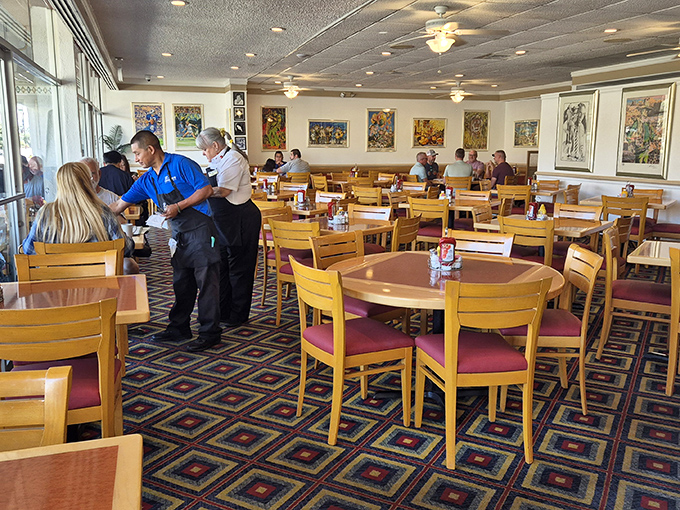 The dining room hums with conversation and clinking plates, while colorful artwork adds a distinctly Palm Springs vibe.