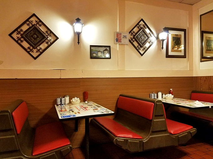 The wall sconces and diamond-patterned art create that perfect diner ambiance&mdash;like stepping into a Norman Rockwell painting where calories don't count.