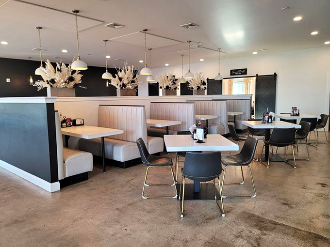 Modern meets cozy in this dining space where cream-colored booths invite you to settle in and contemplate a second helping.