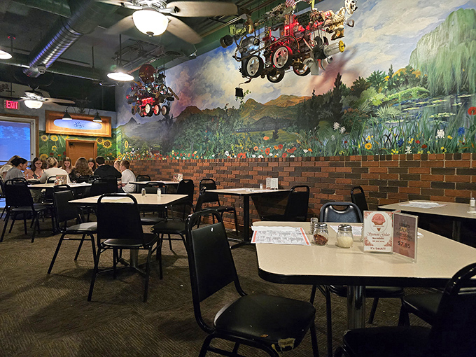 Murals transport you to an Italian countryside that probably never existed but feels more authentic than reality. Dining room magic at its finest.